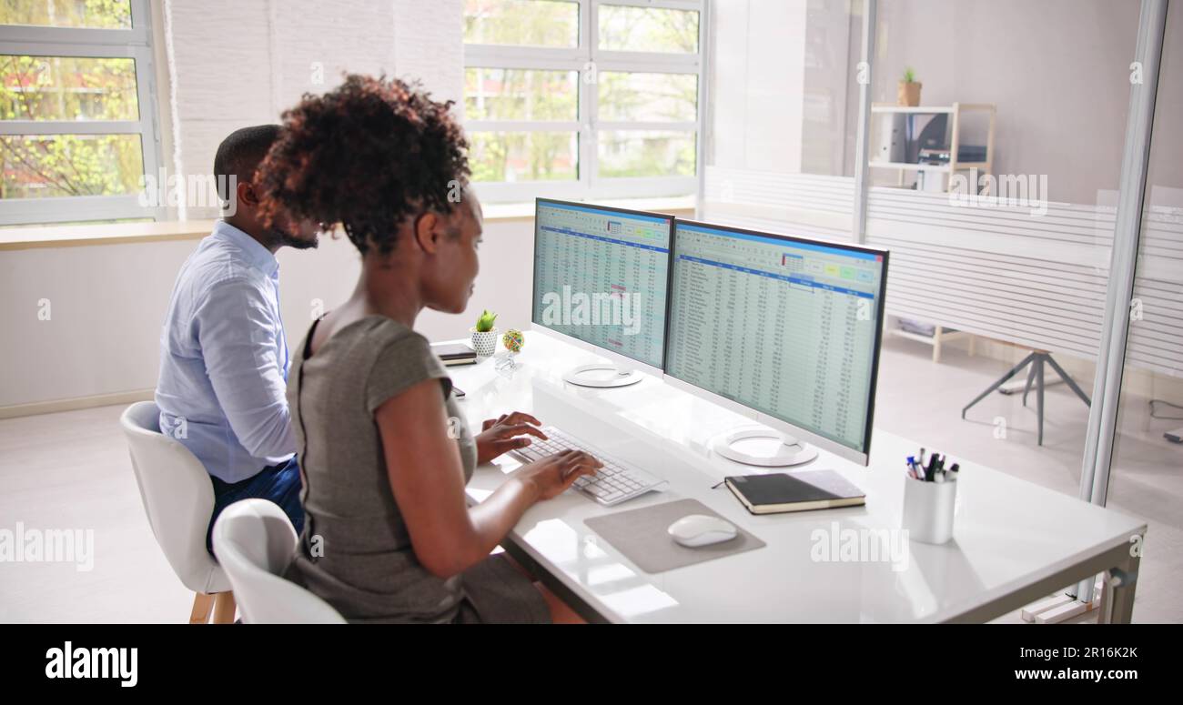 Analyst Employee Working On Spreadsheet Using Desktop Computer Stock ...