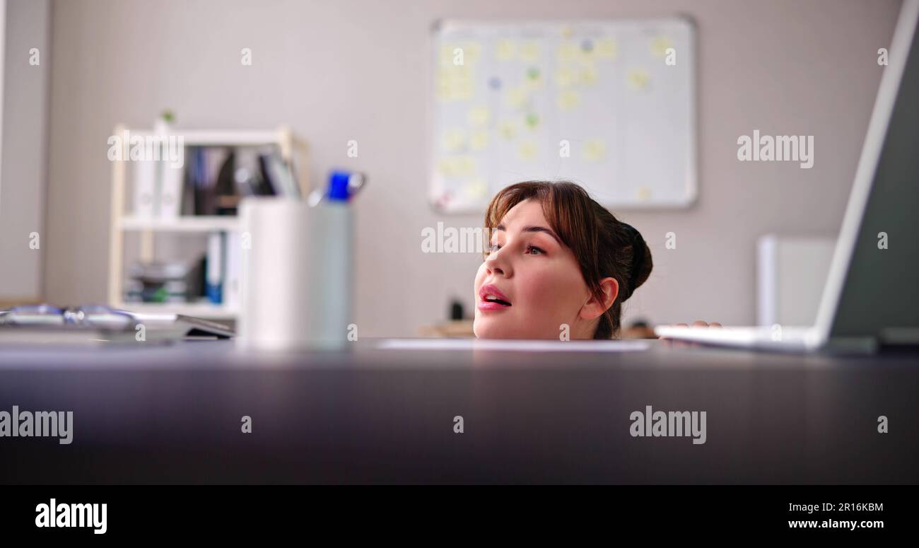 Girl hiding behind chair hi-res stock photography and images - Alamy