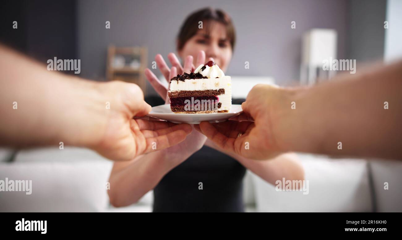 Woman refusing cake hi-res stock photography and images - Alamy