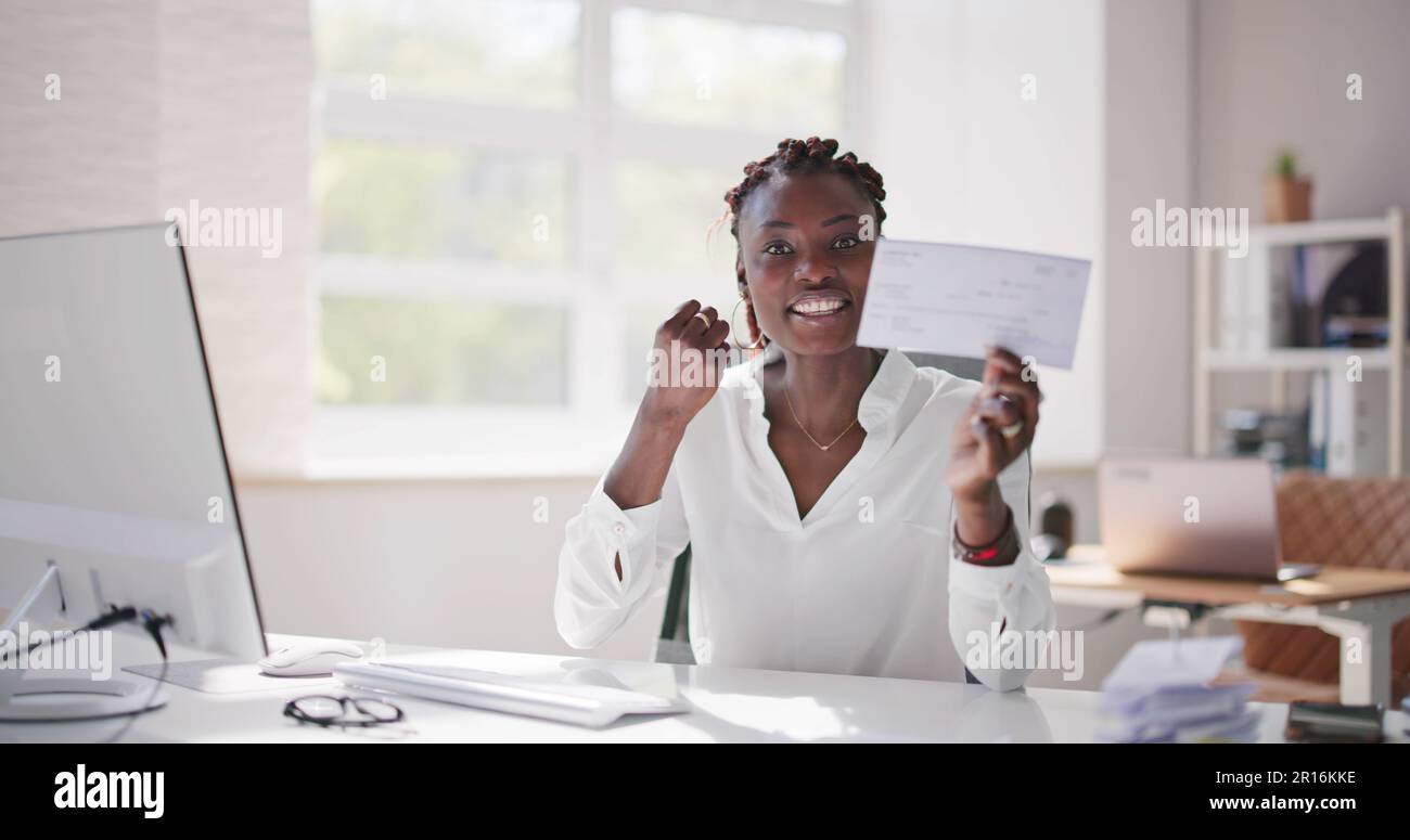 Holding Paycheck Or Payroll Check Or Insurance Cheque In Hand Stock ...