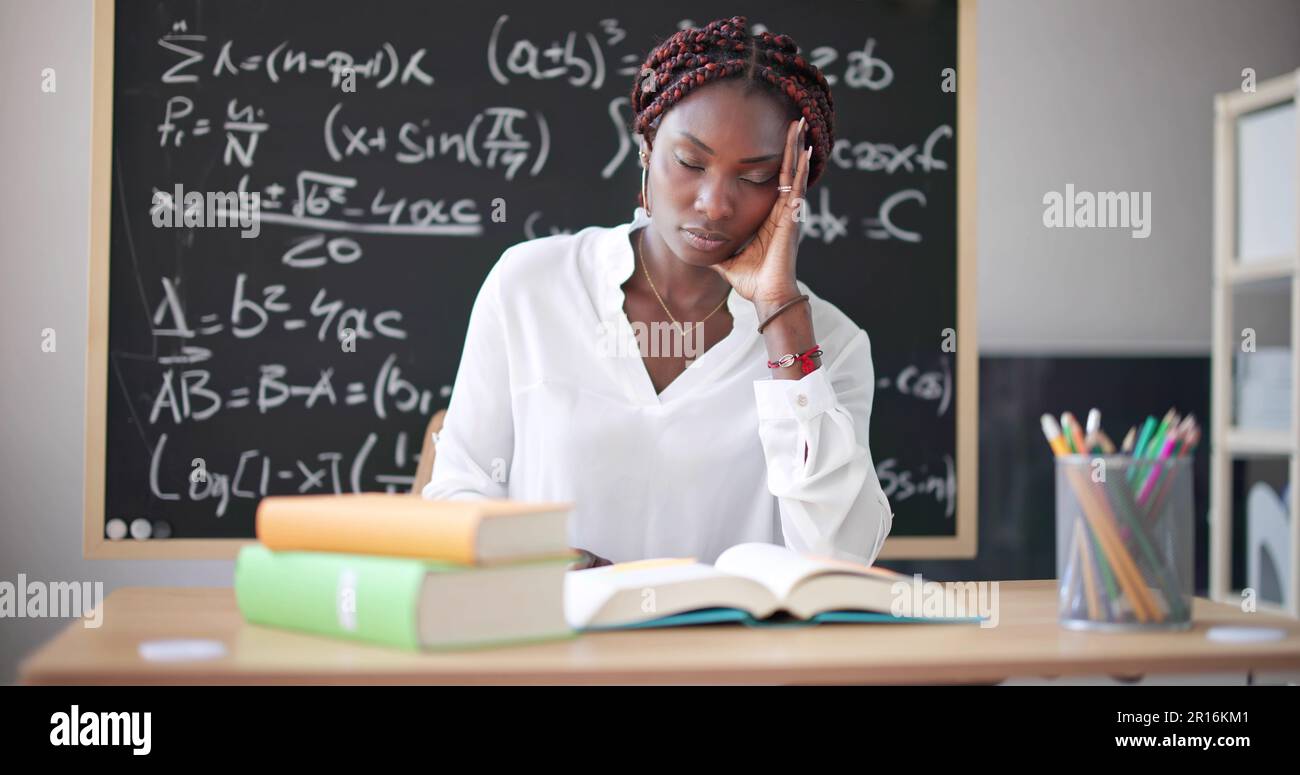 Frustrated Sad College Aftrican Teacher With Books Stock Photo - Alamy