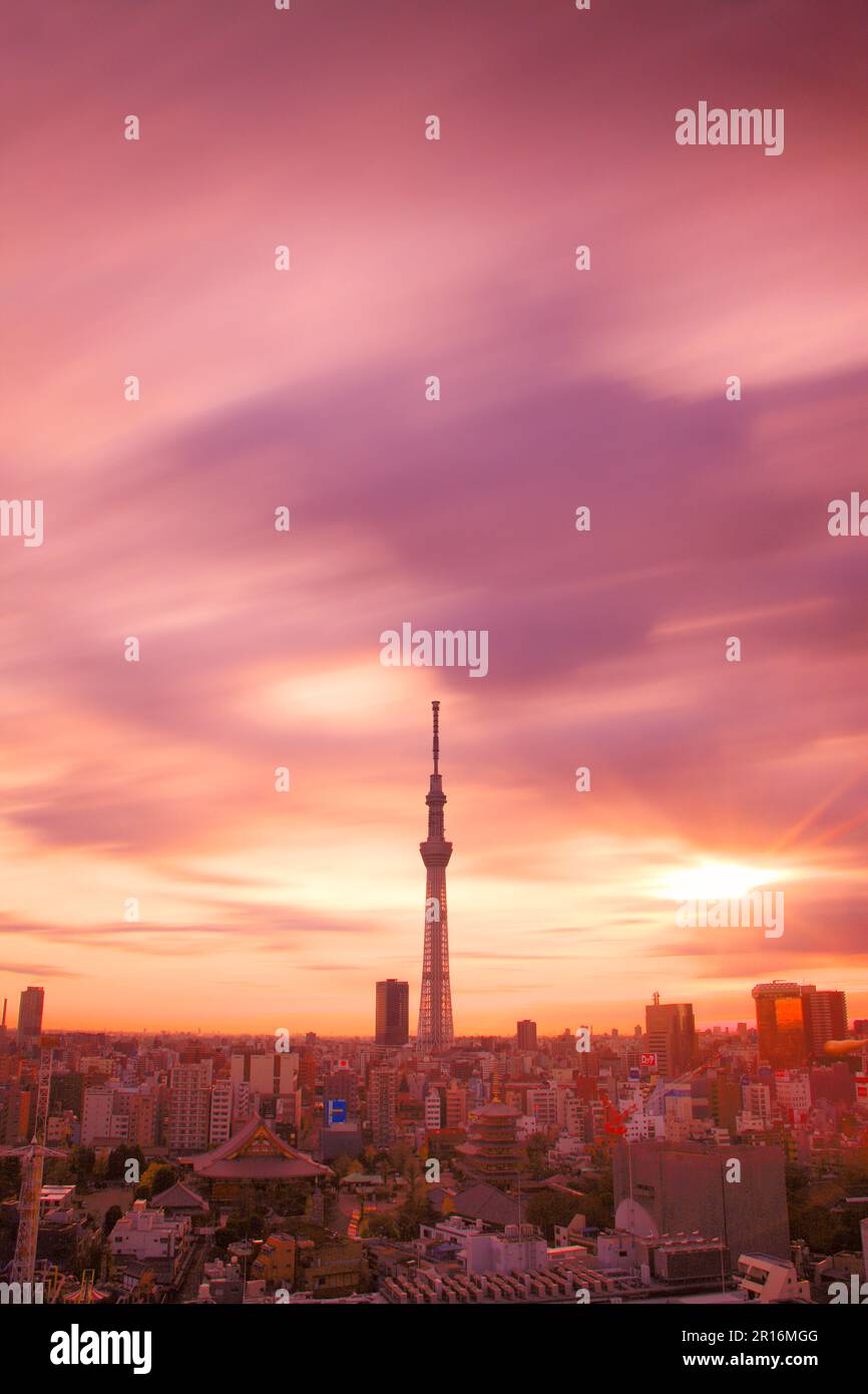 Tokyo Sky Tree and the glow of the morning sun and floating clouds ...