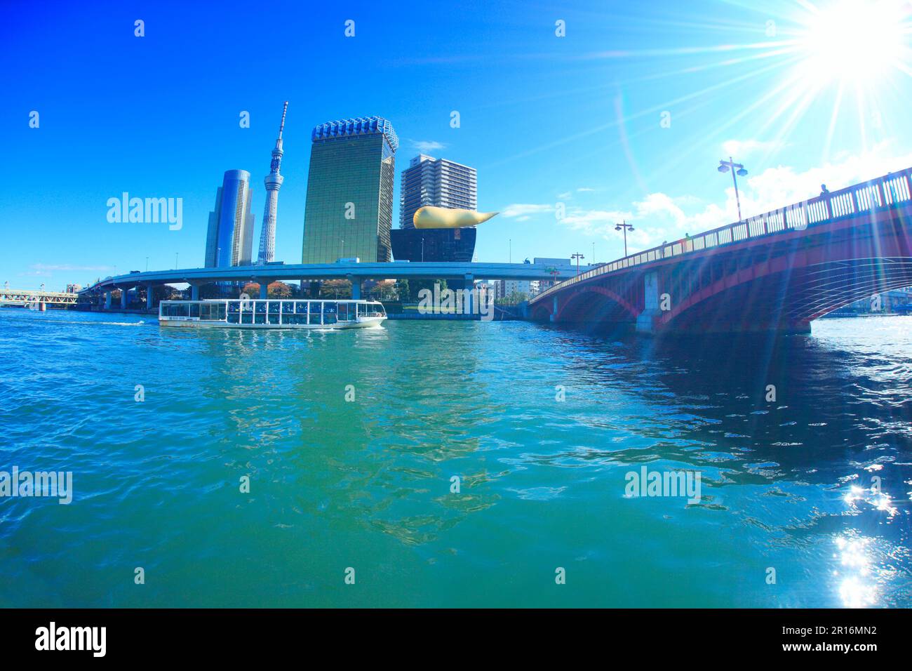 Glow of sun and sightseeing boat and Azumabashi and Tokyo Sky Tree ...