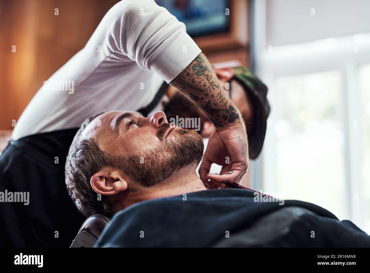 Man getting hair trimmed barbershop hi-res stock photography and images ...