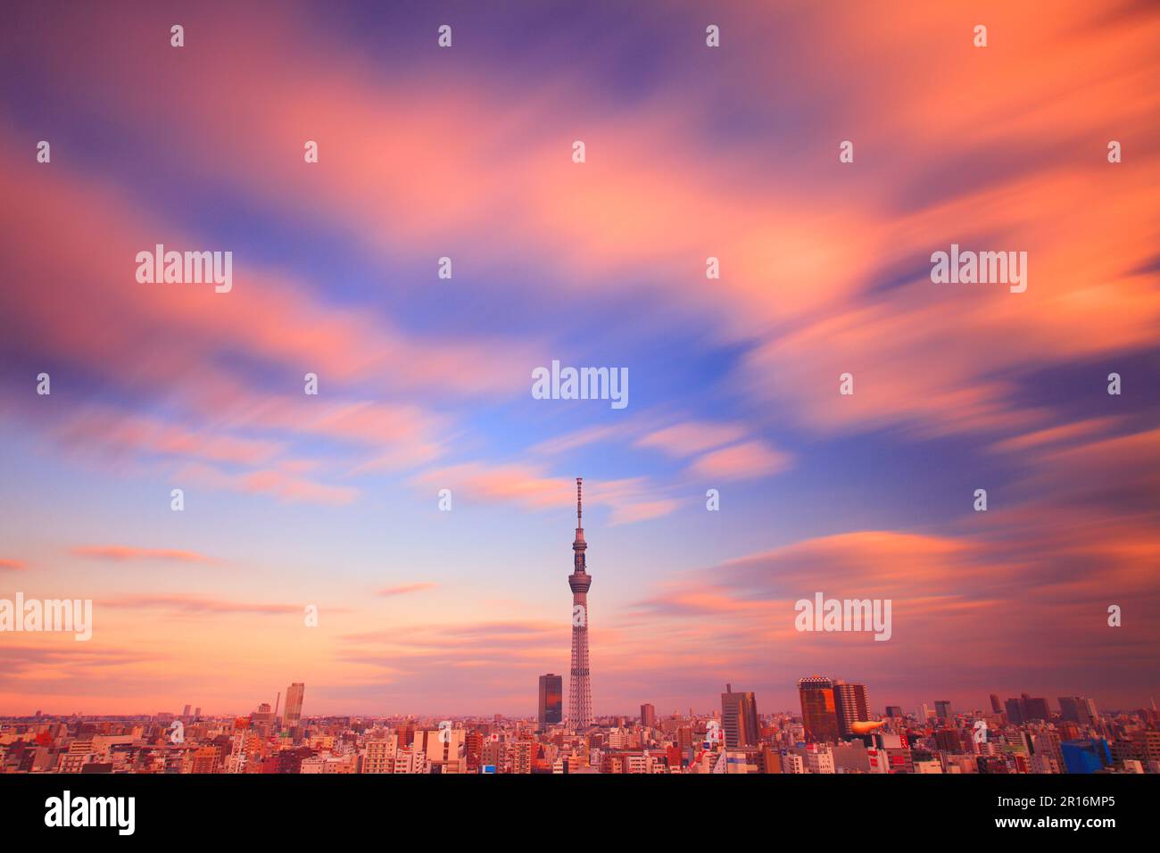 Floating clouds at sunset and Tokyo Sky Tree Stock Photo - Alamy
