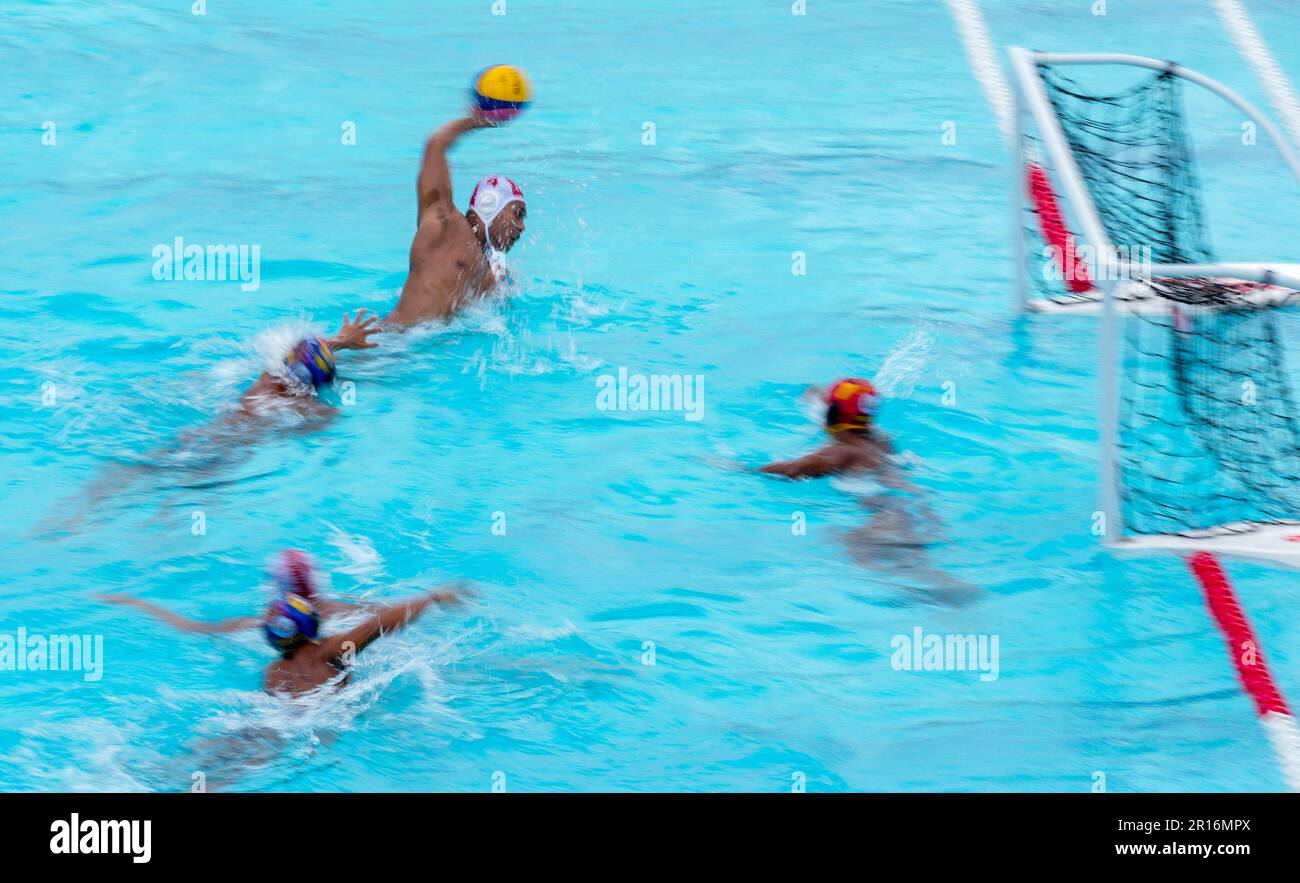 Indonesia's Ahmad Fauzi, center, throws the ball against Cambodia's ...