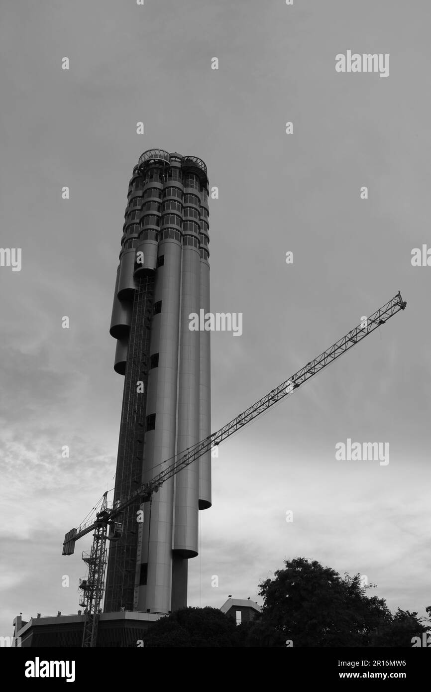 Workers dismantling a tall crane at Roi Et tower in Roi Et Thailand Stock Photo - Alamy