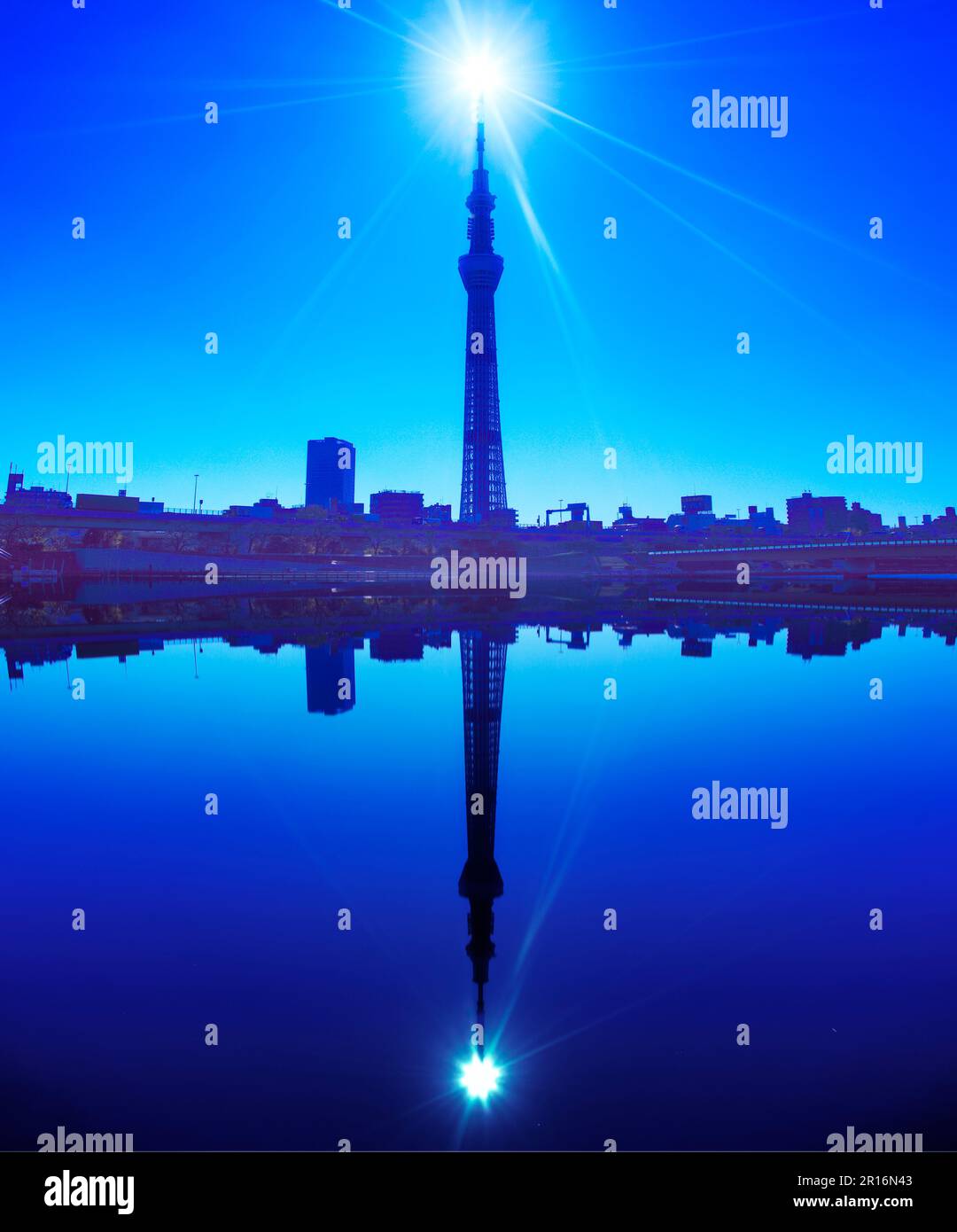 Glow of the sun and Tokyo Sky Tree reflection in Sumida Stock Photo - Alamy
