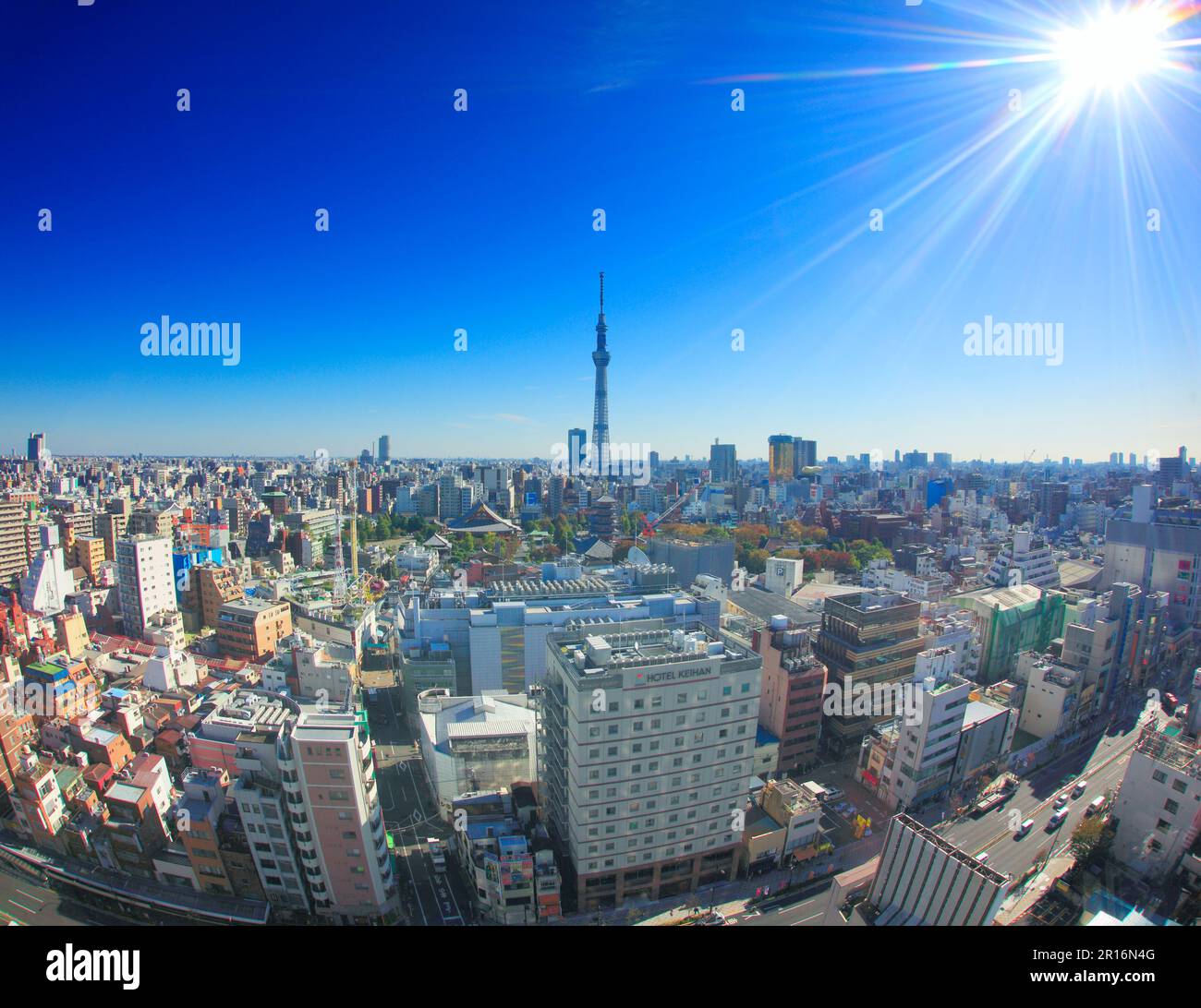 Glow of the sun and the Senso-ji Temple and Tokyo Sky Tree Stock Photo ...