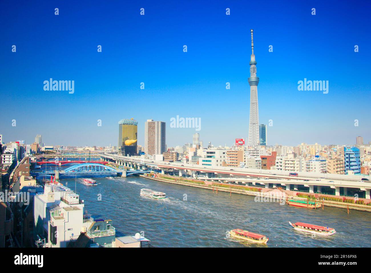 Tokyo Skytree, Sumida River, Komagata Bridge and moving ships at Sunset ...