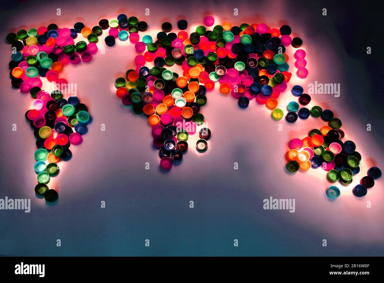 world map from the plastic caps in the dark Stock Photo - Alamy