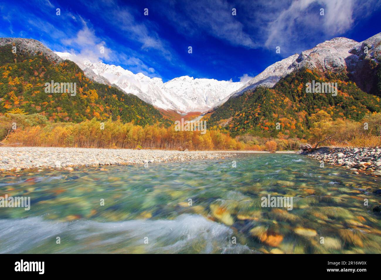 Fresh snow, Hodaka mountain range in autumn, and Azusa river Stock ...