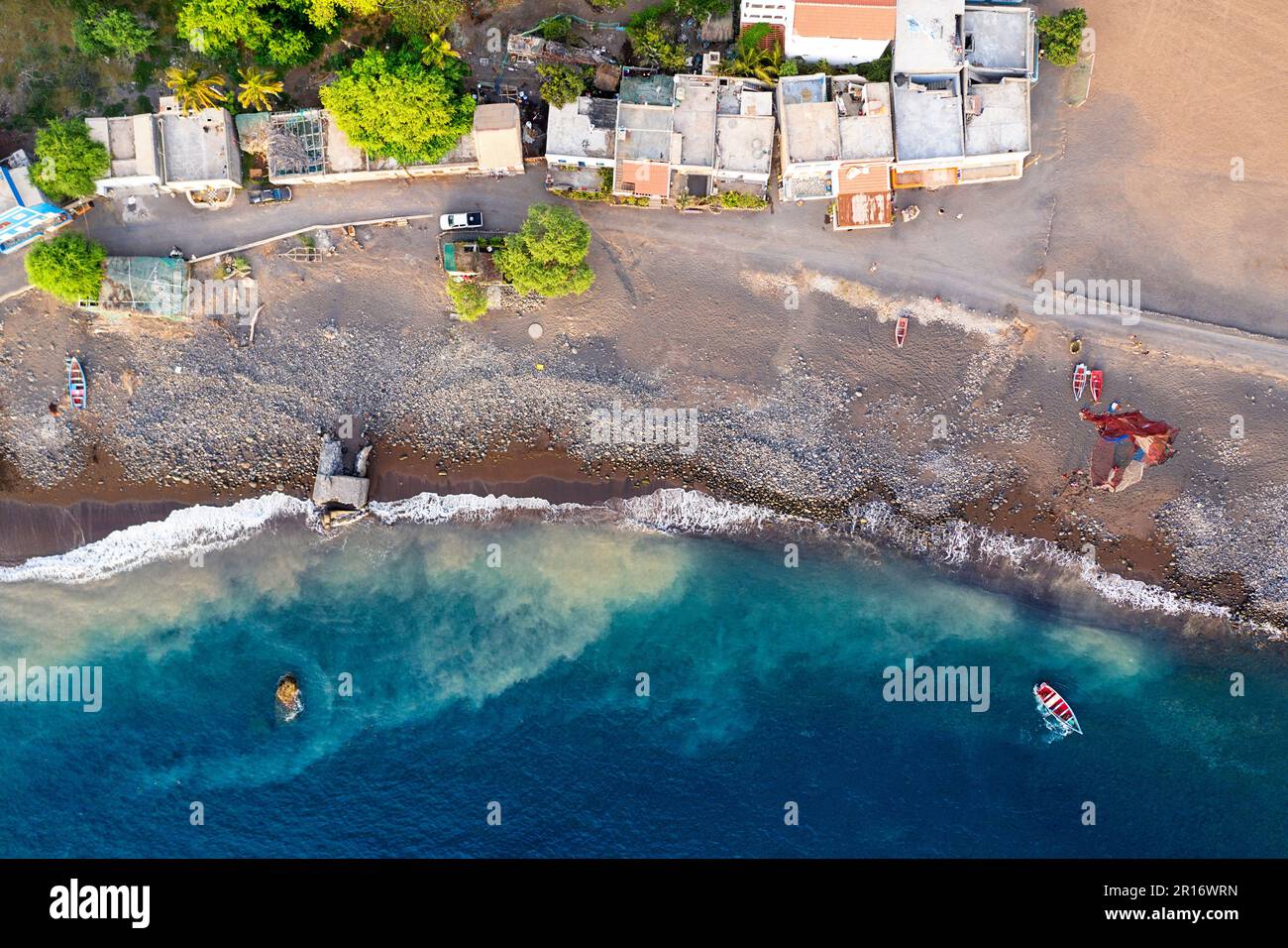 Colorful boats in the water and on the beach in small village Tarrafal ...