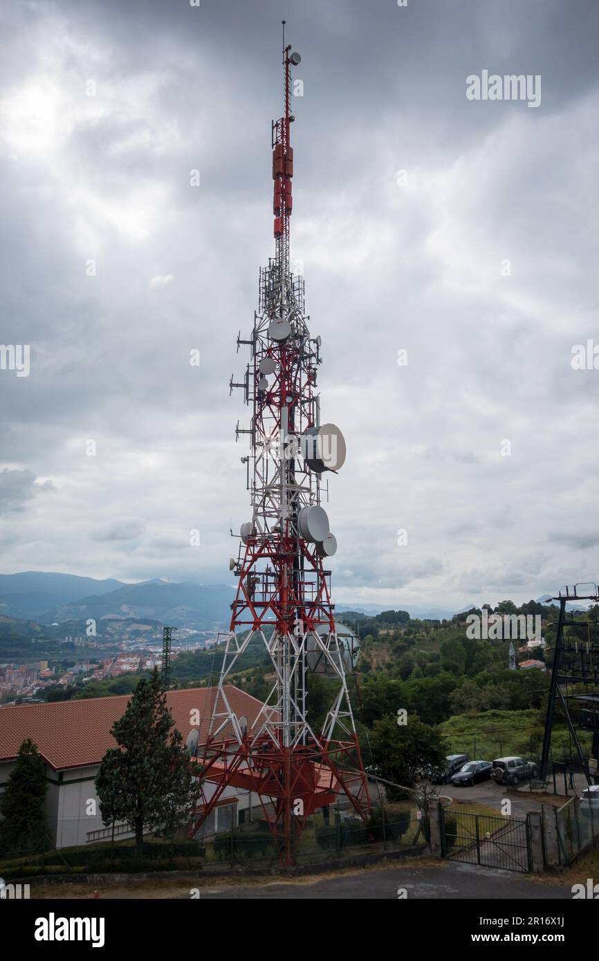 Television and phone antenna. Big red and white tower Stock Photo - Alamy