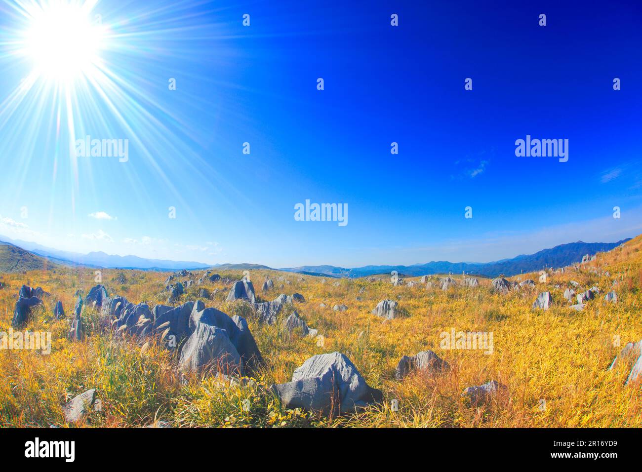 Fish eye view of the glowing sun on mount Ryugomine and limestone of ...