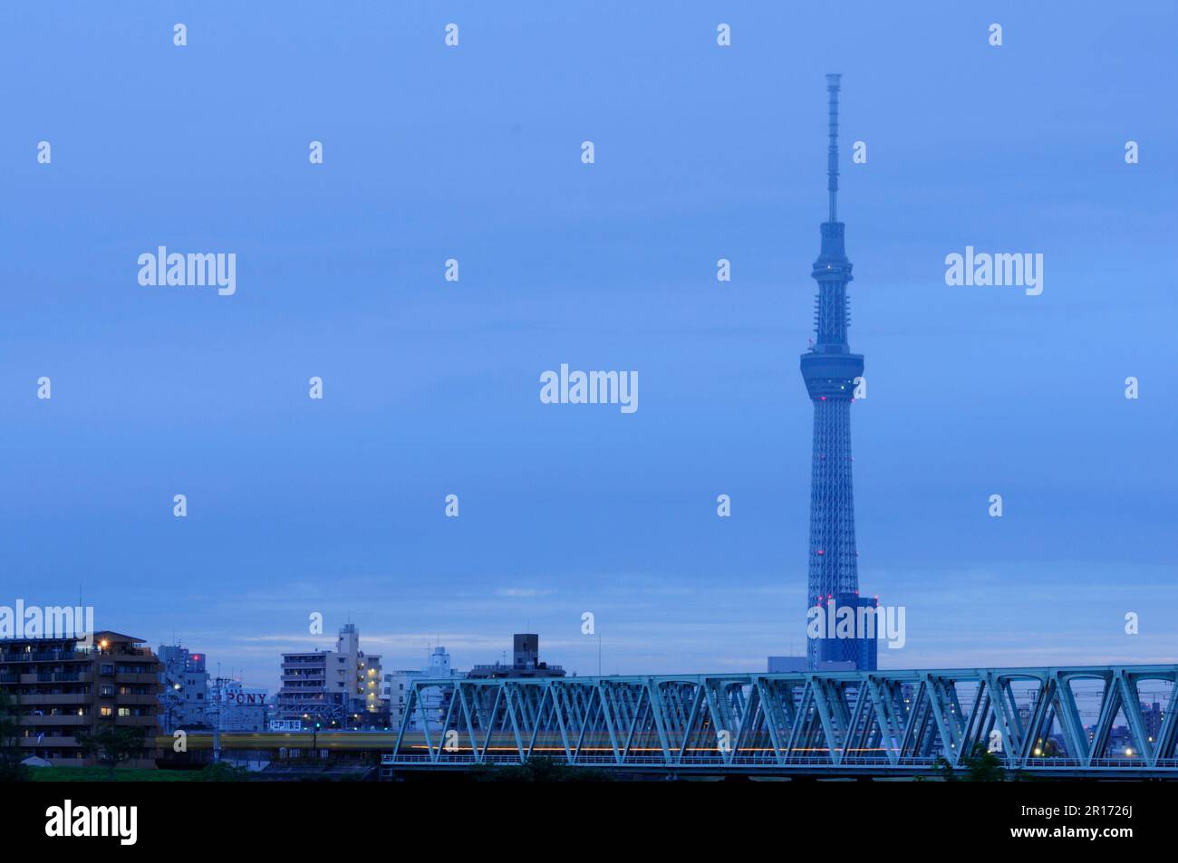 Sobu line and Tokyo sky tree at sunset Stock Photo - Alamy