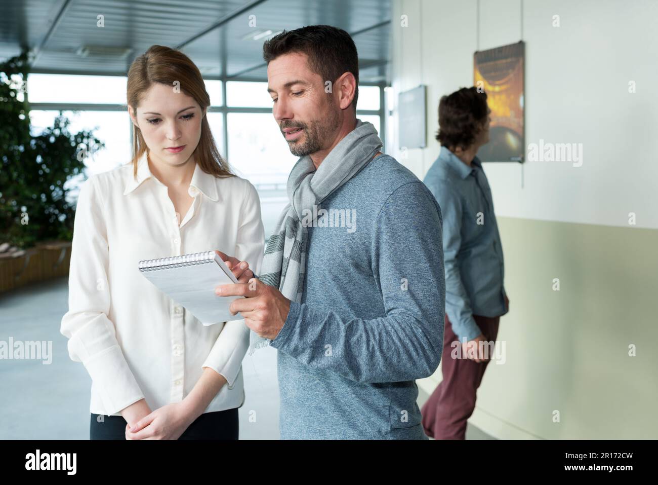busy office building corridor two business people takin notes Stock ...