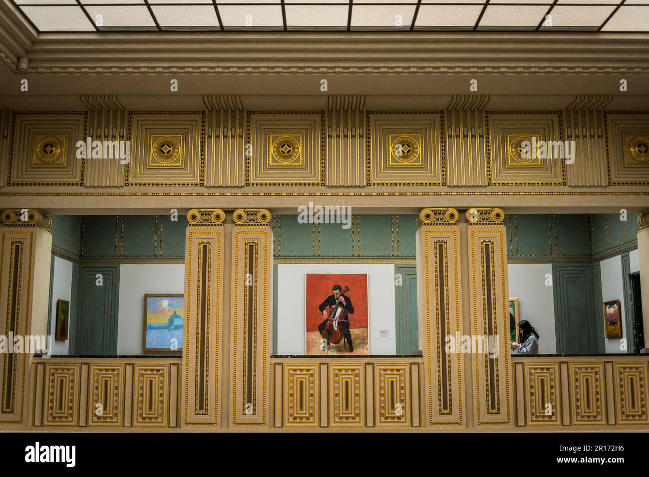 Painting of cello player framed by Neo-Greek version of Secession style ...