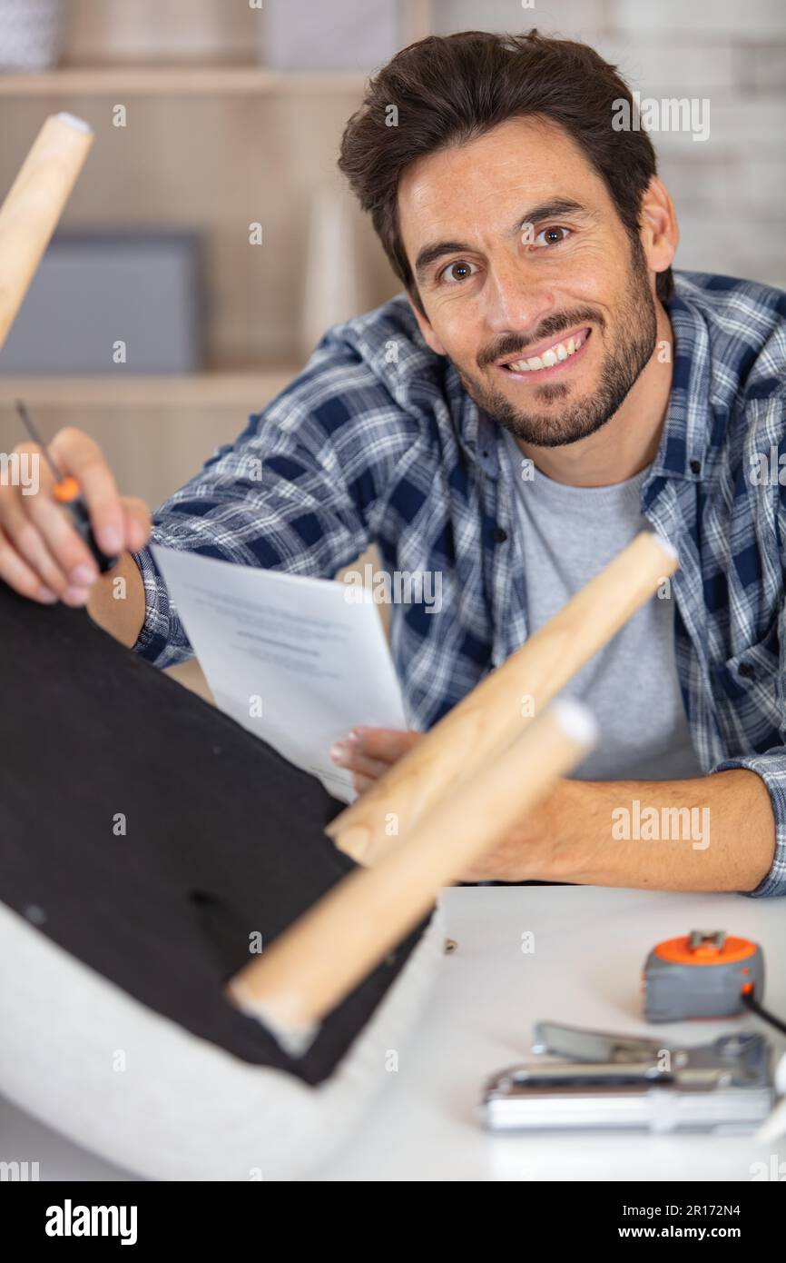 Man repairing sofa hi-res stock photography and images - Alamy