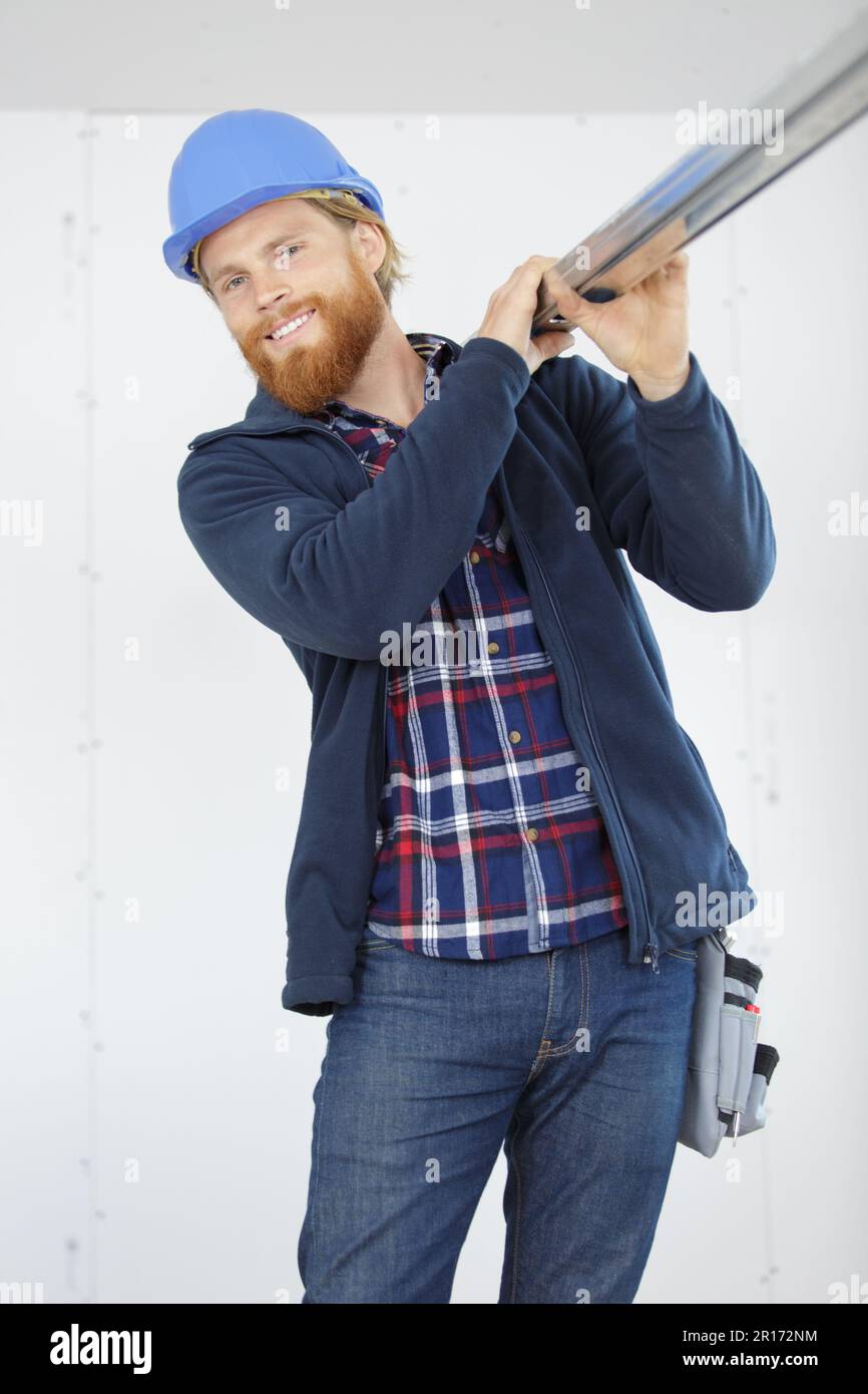Man carrying metal beam hi-res stock photography and images - Alamy