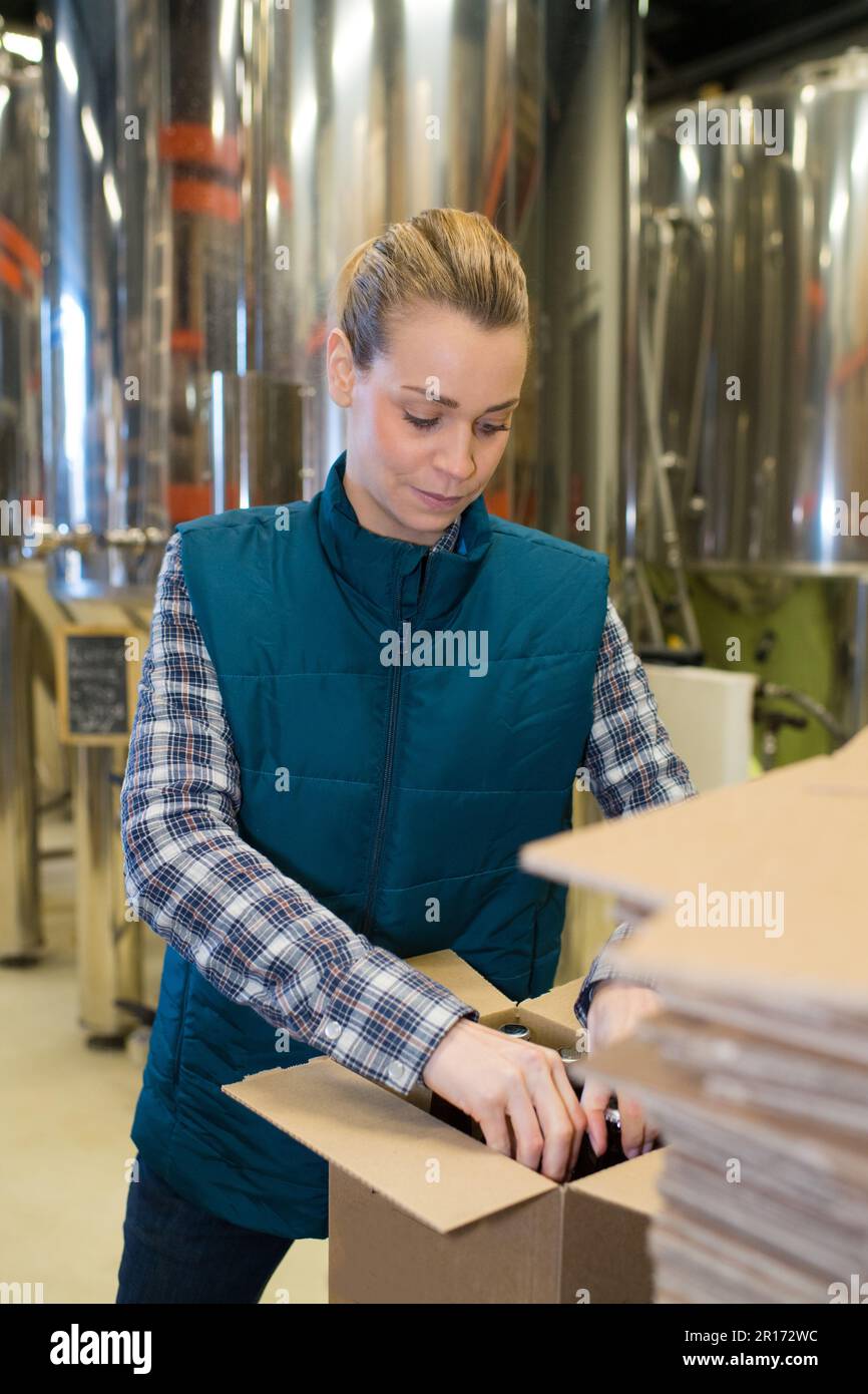 Female worker packing box in warehouse hi-res stock photography and ...