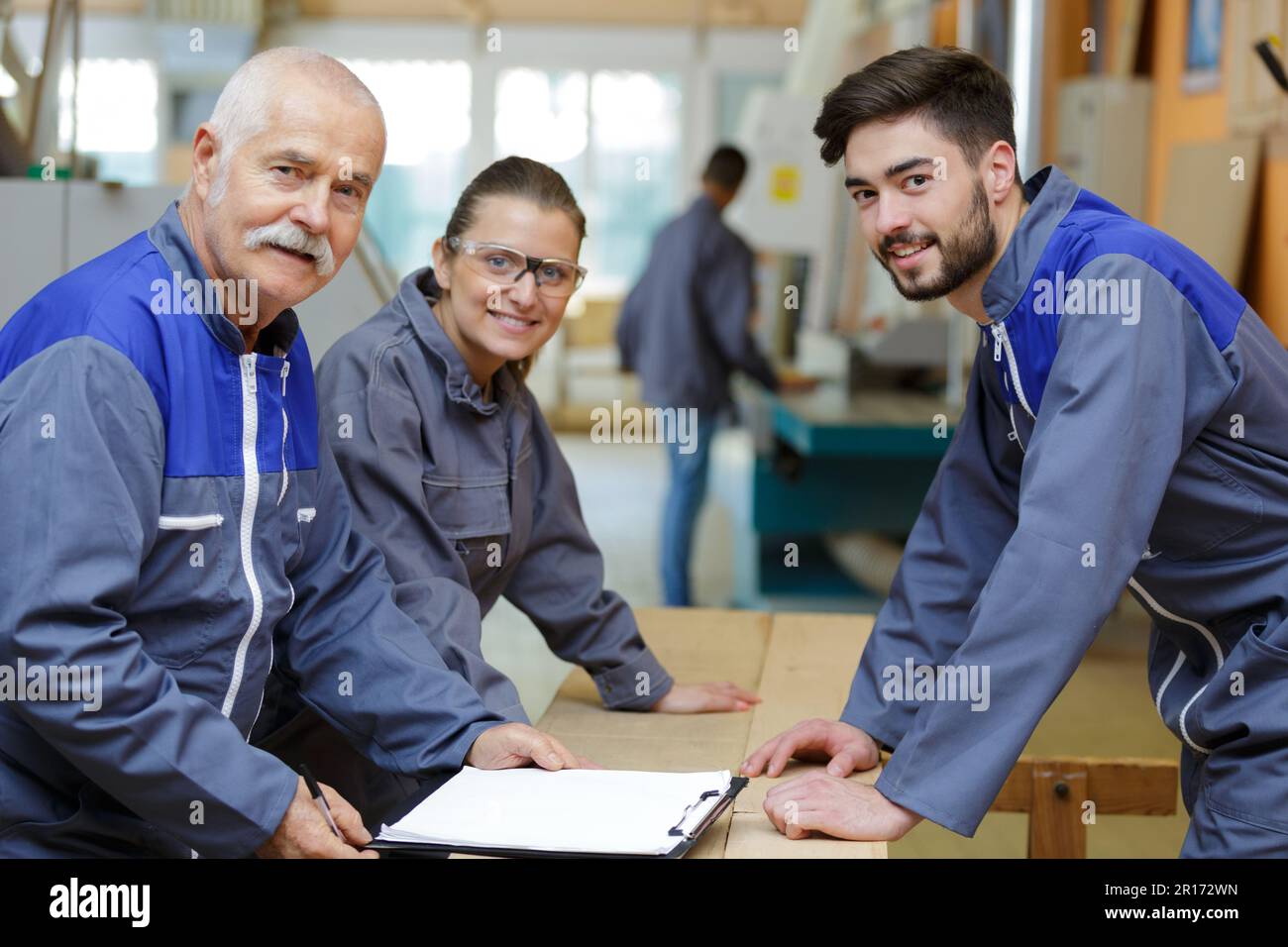 group of industrial people posing Stock Photo - Alamy