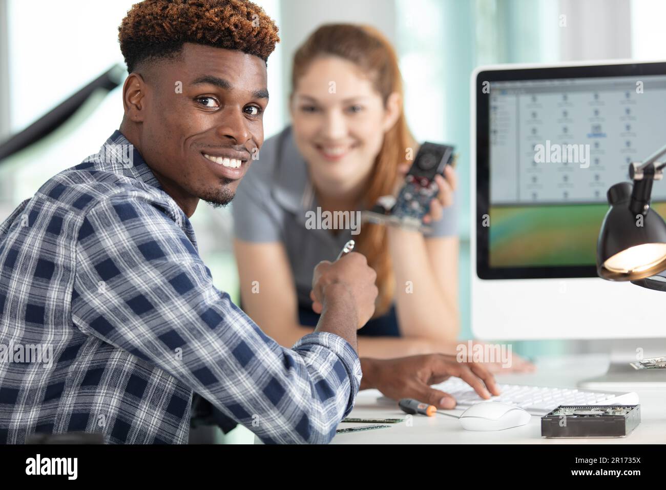cheerful students training for electronics Stock Photo - Alamy