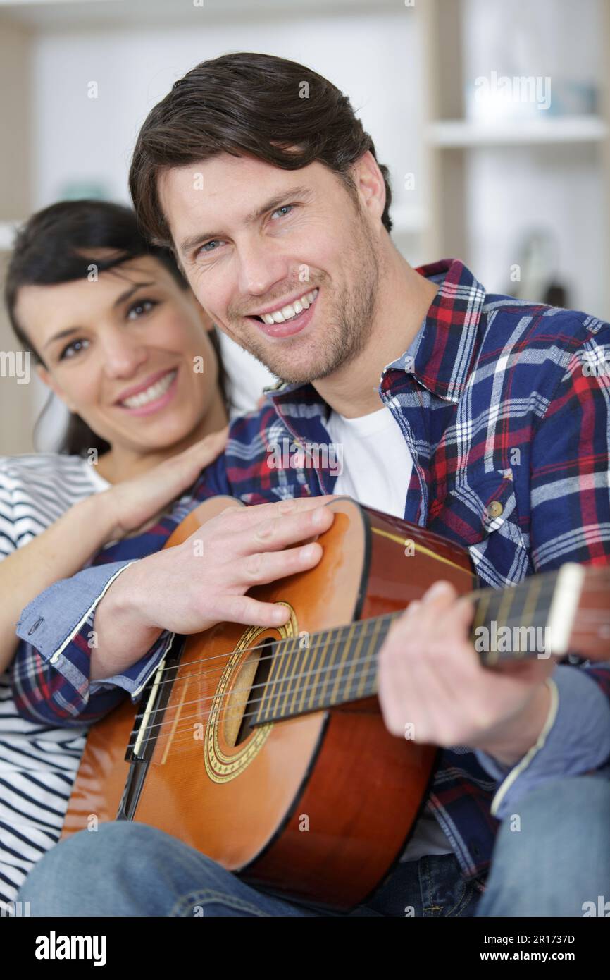 Couple cuddled up on sofa hi-res stock photography and images - Alamy