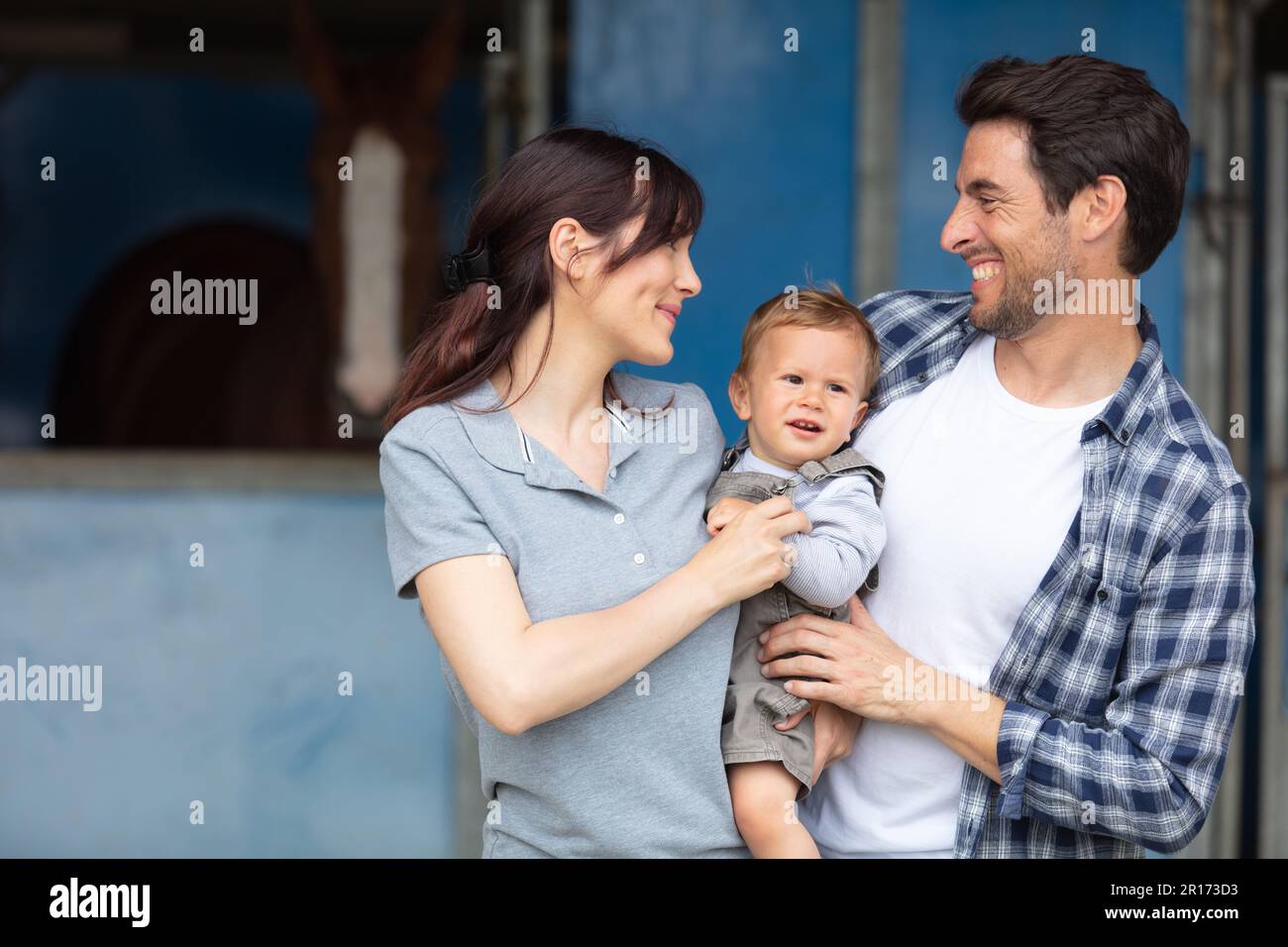 couple with their infant child at the riding stables Stock Photo - Alamy