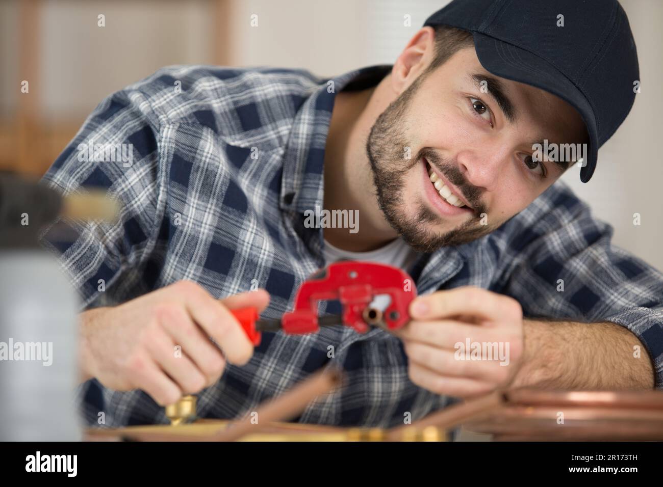 happy worker during cooper welding soldering Stock Photo - Alamy