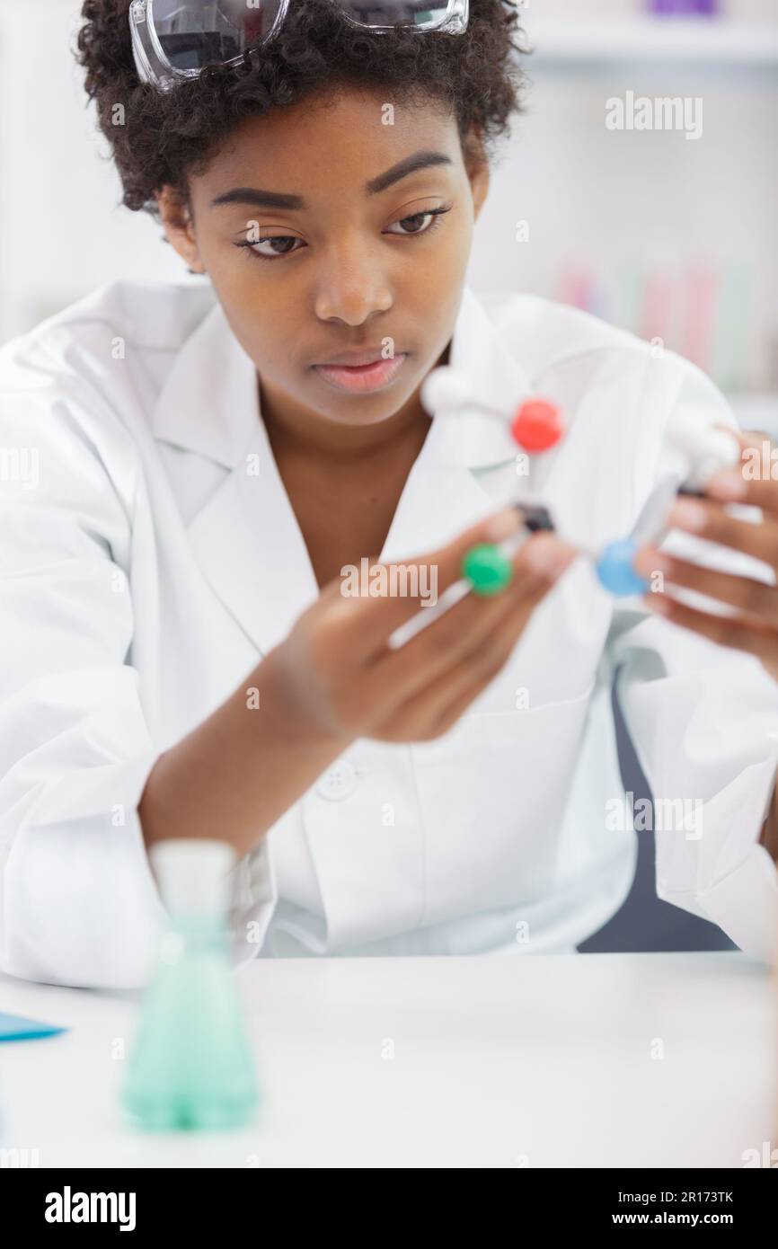 a young woman lab assistant in a genetics lab Stock Photo - Alamy