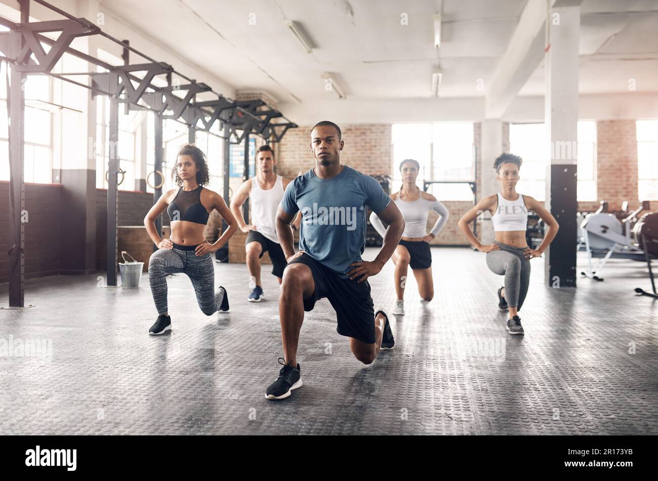 Make those moves to get those muscles. a group of young people doing ...