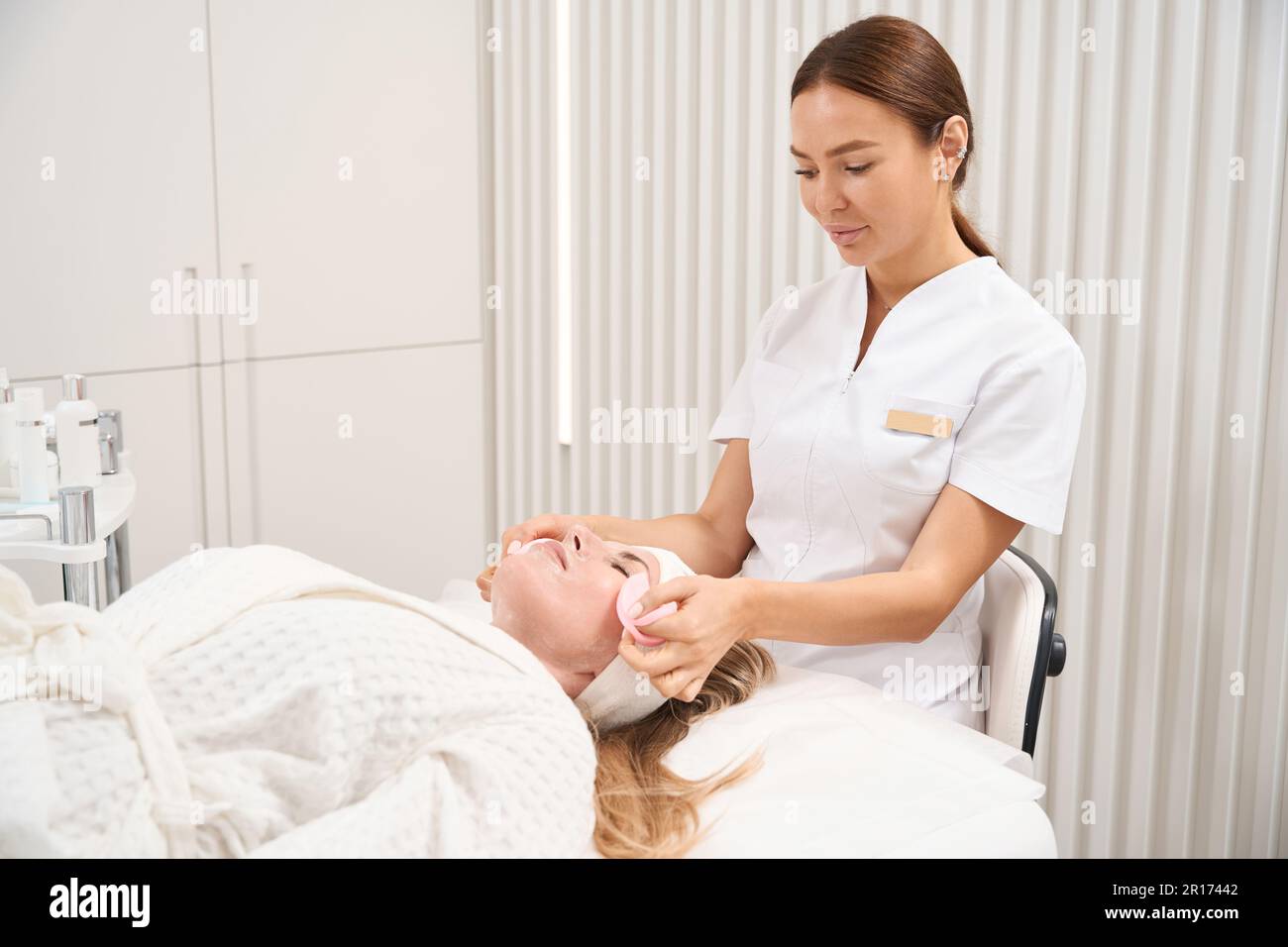 Female at session of care procedures in aesthetic medicine clinic Stock ...