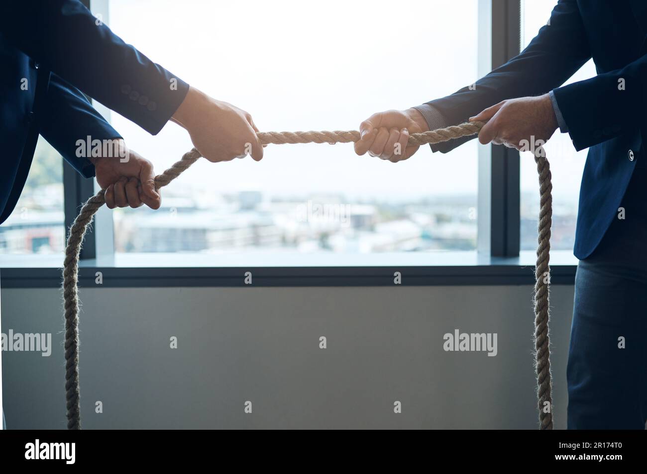 You have to work for what you want. two businessmen pulling on a rope ...