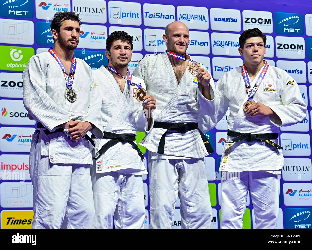 Doha, Marcus Nyman (2nd R) of Sweden and Murao Sanshiro of Japan pose ...