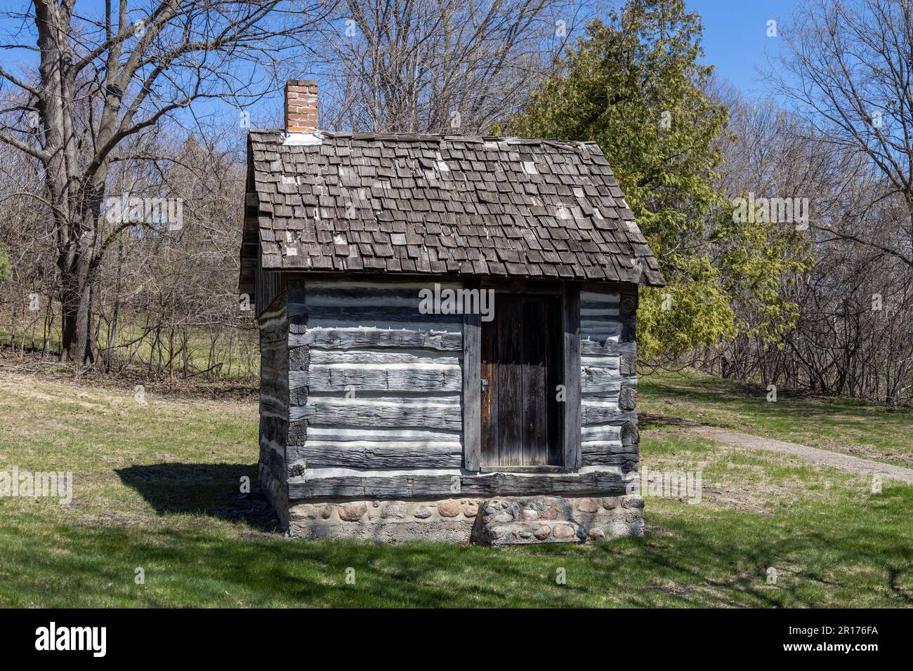 Rustic small 19th century single room log cabin in a rural area in the ...