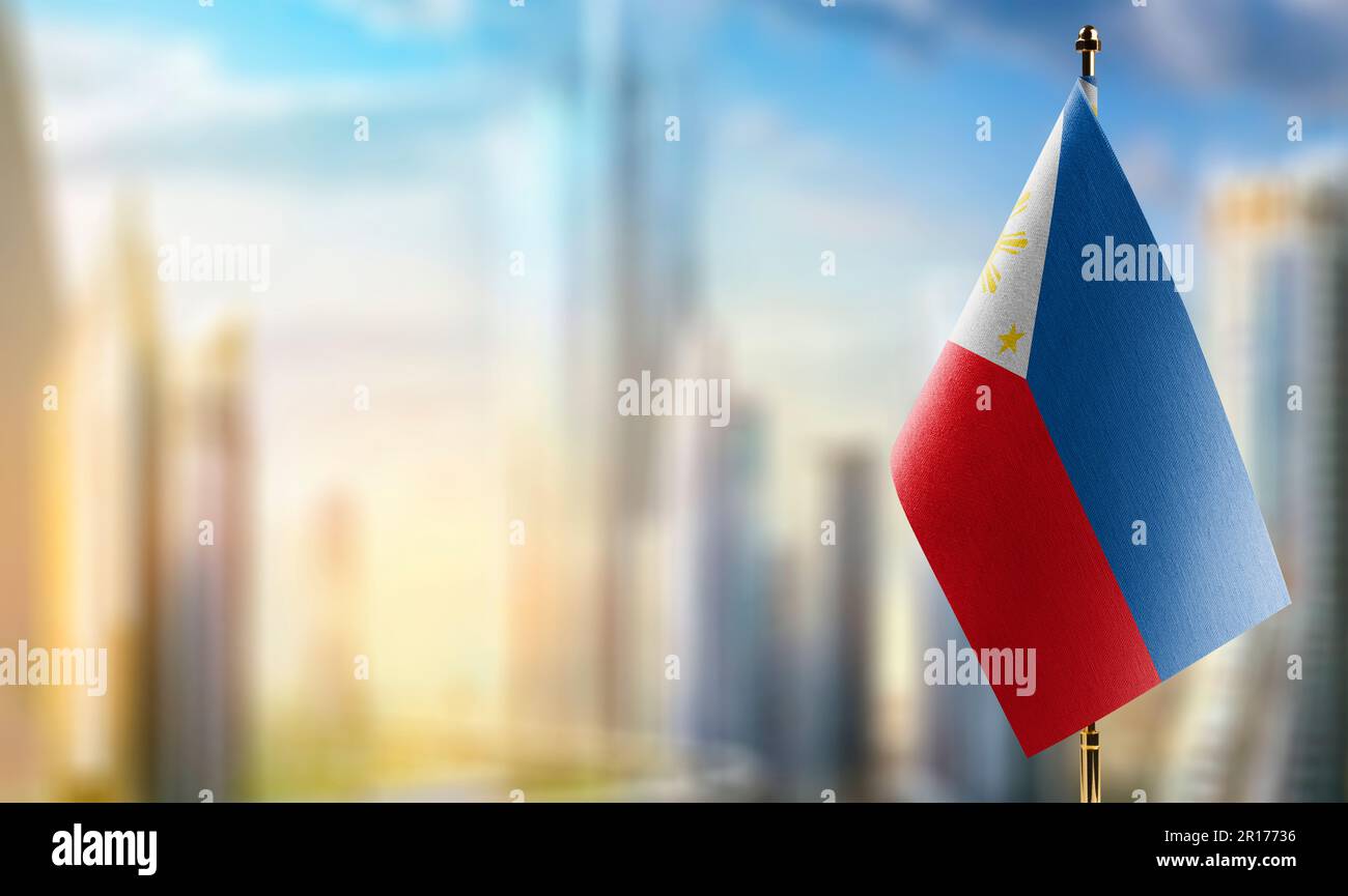 Small flags of the Philippines on an abstract blurry background Stock ...