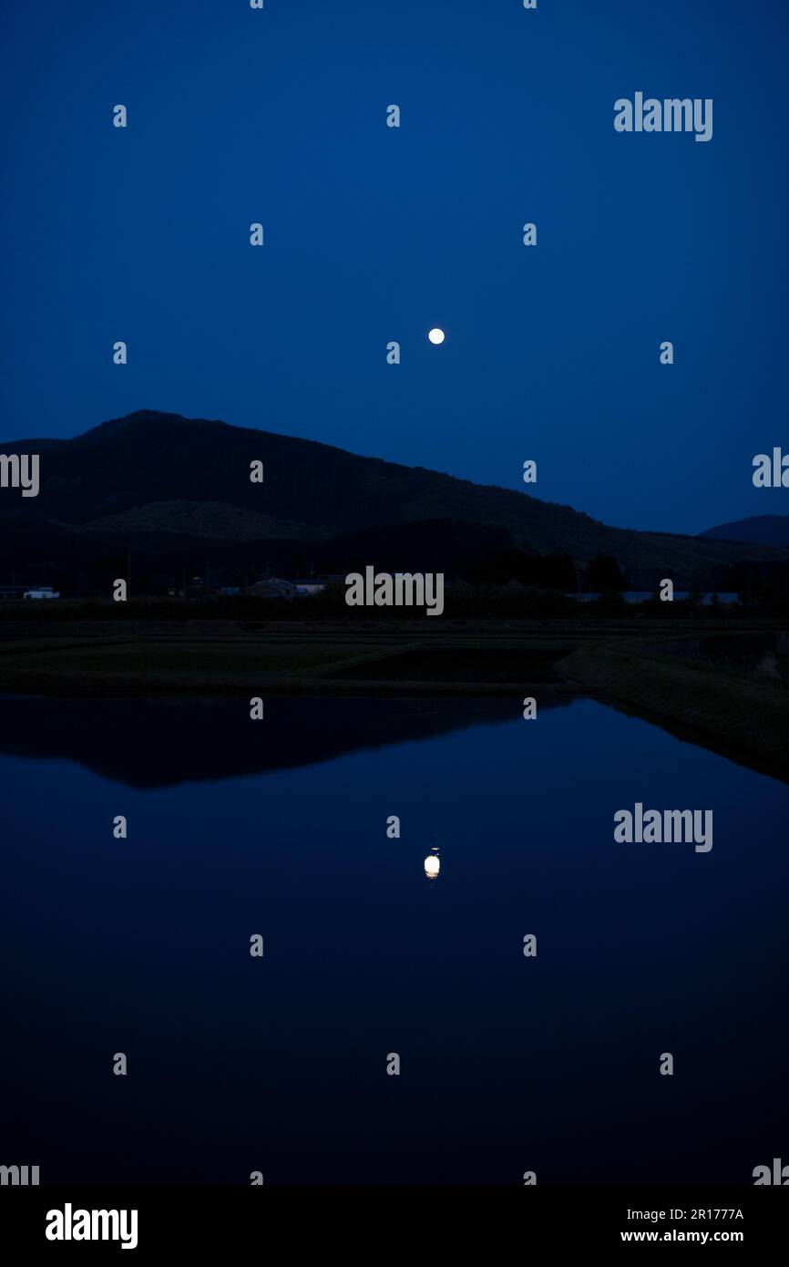Moon floating in the night sky and mountains Stock Photo - Alamy
