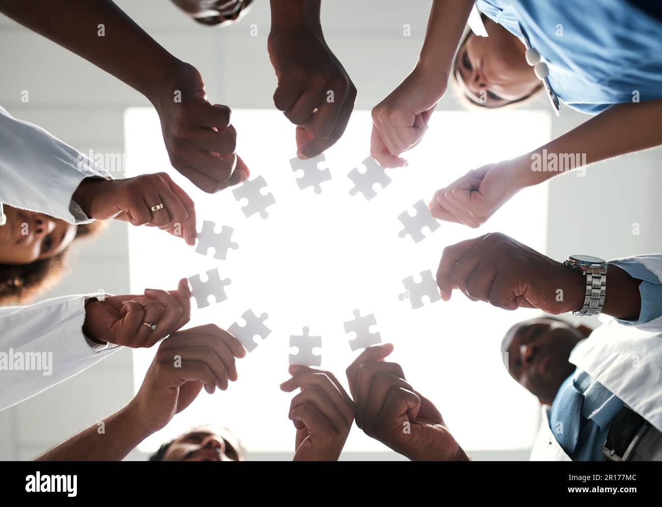 Piecing together a puzzle hi-res stock photography and images - Alamy