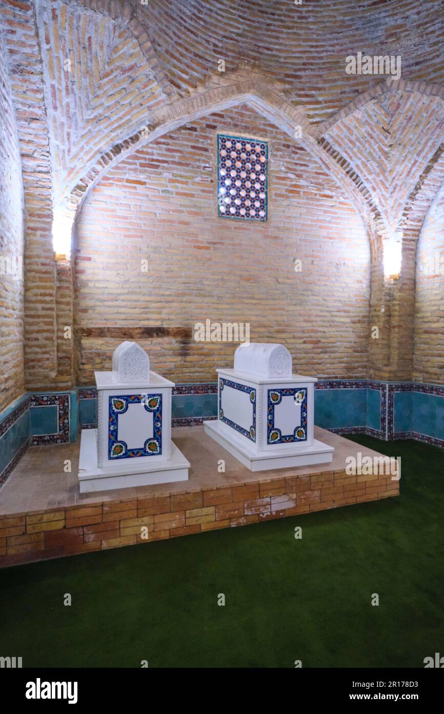 In a small room, two white marble graves, tombs. At the Sheikh Hovendi ...