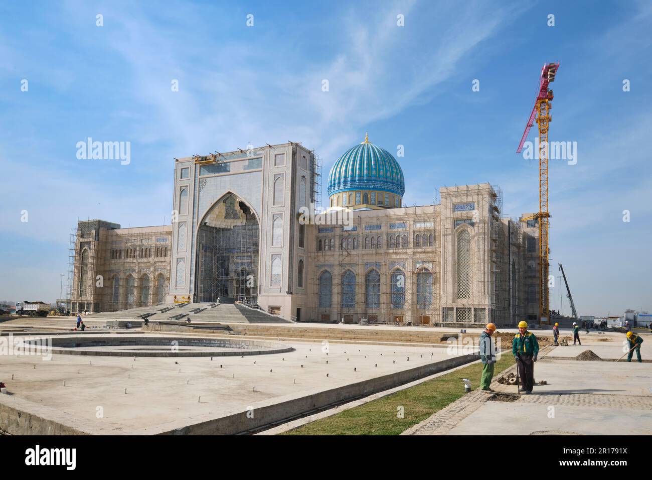 View of one of the facades, blue dome and crane. At the huge, giant ...