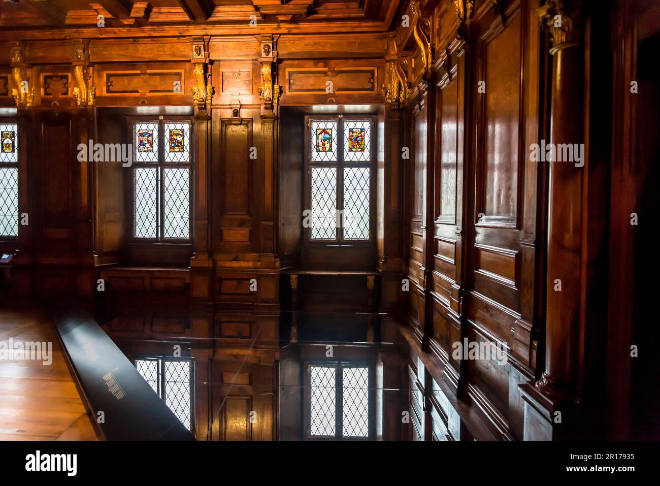 Room with wood panelling and carving and stained glass windows, Swiss ...
