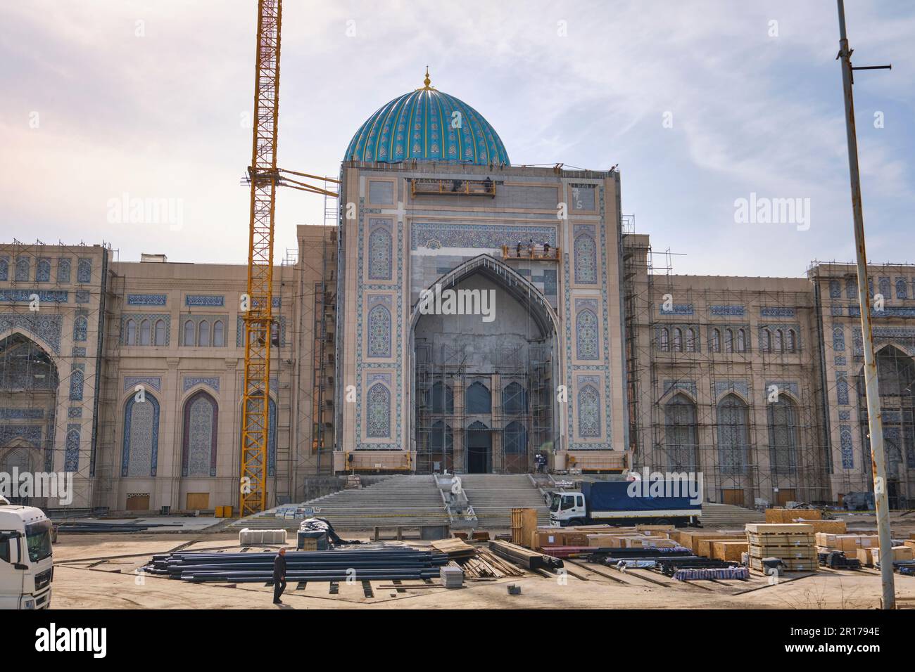 View of one of the facades, blue dome and crane. At the huge, giant ...