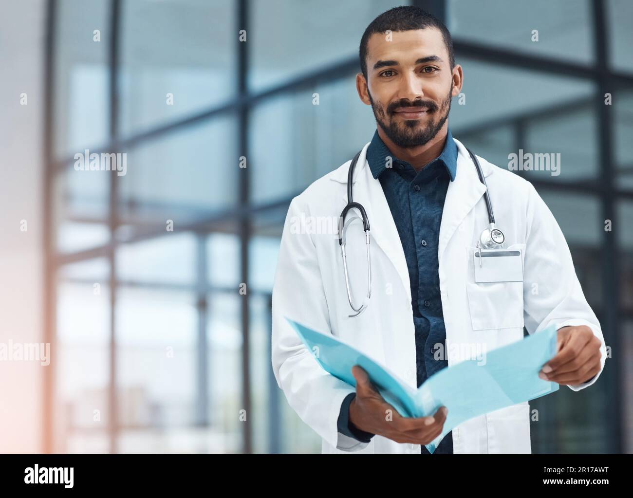 Are you ready for your checkup. Portrait of a young doctor going over ...