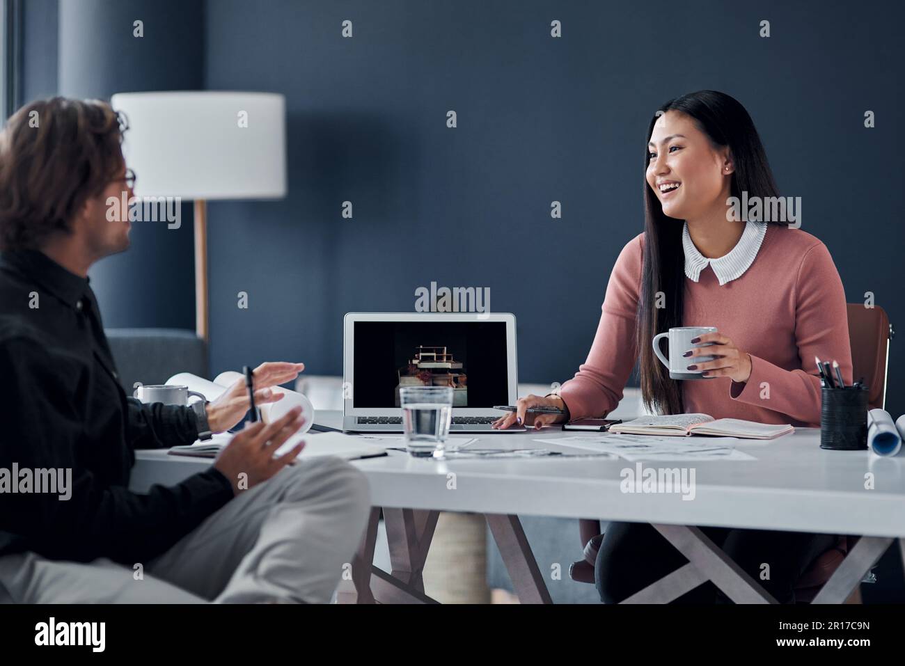 We always have the same ideas in mind. two young architects going over ...