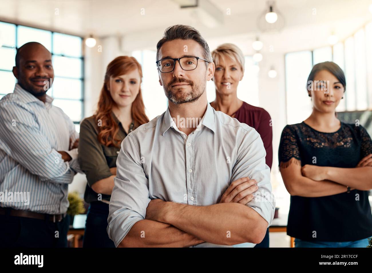 Success powered by teamwork. Portrait of a group of confident ...