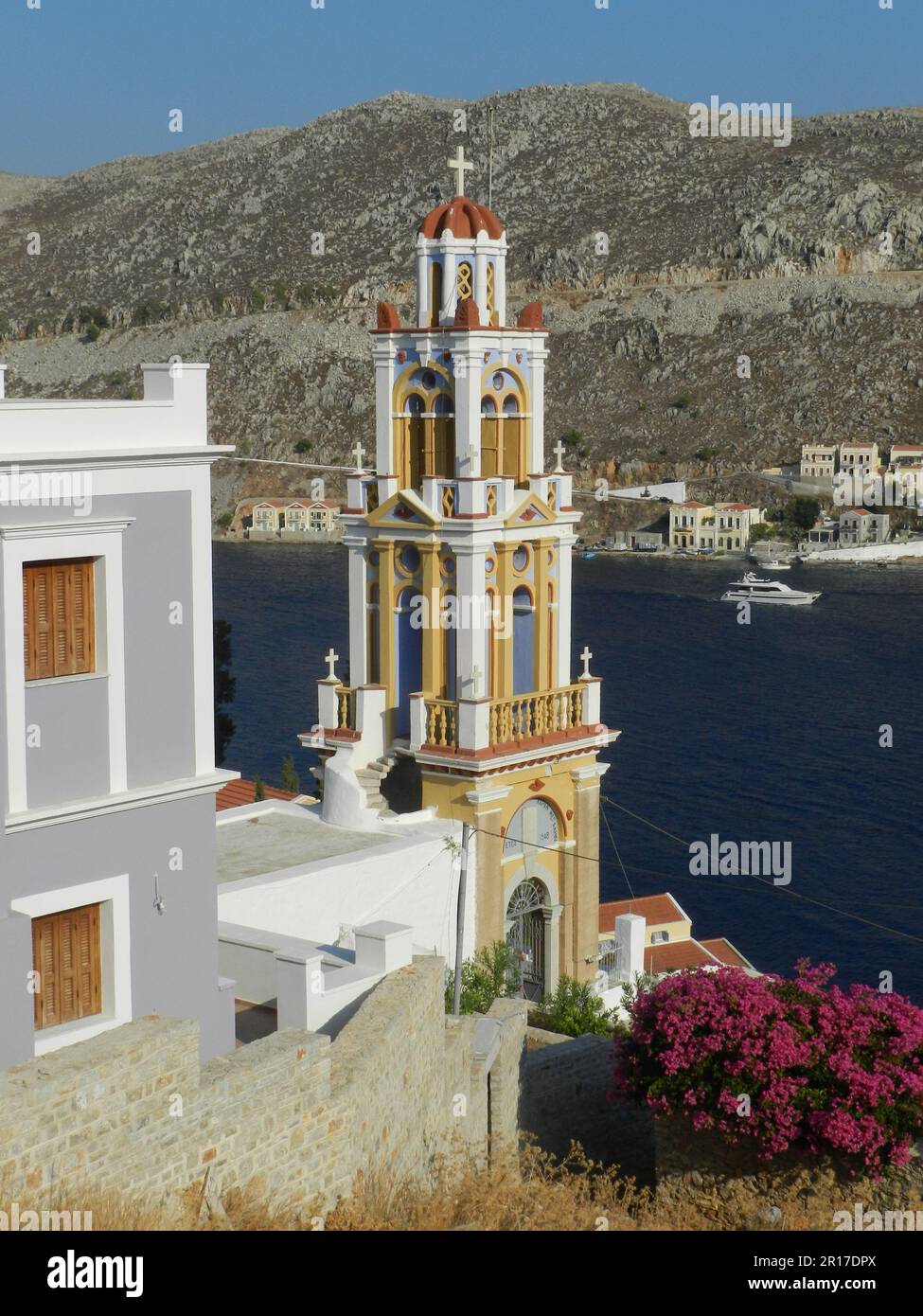 Greece, Island of Symi: colourful tower of the Orthodox church, with ...