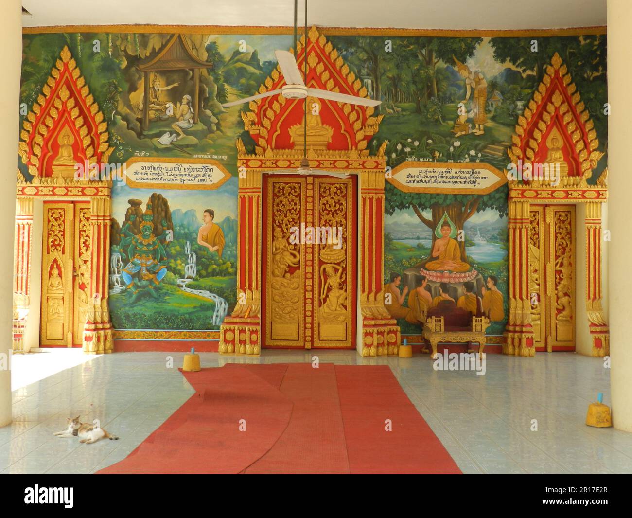Laos, Vientiane: paintings depicting the life of Buddha round the main ...