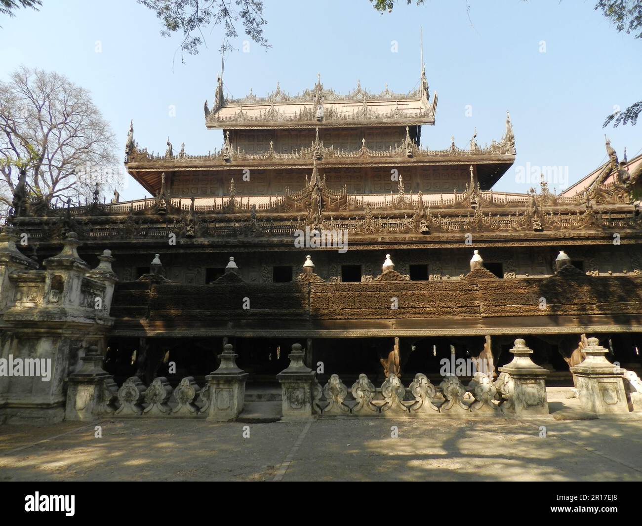 Myanmar, Mandalay: wooden carvings cover the exterior of Shwenandaw ...