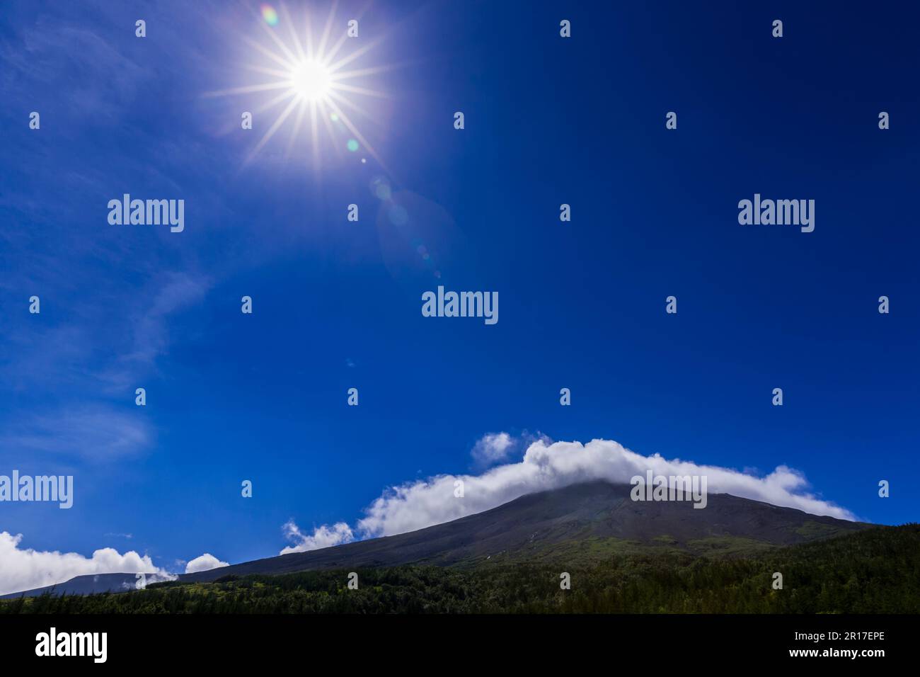 The summit of Mount Fuji and the sun viewed from the fifth station of ...